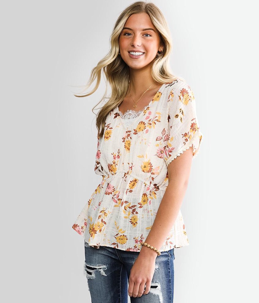 Daytrip Floral Dolman Peplum Top Womens Shirts Blouses In Ivory Buckle